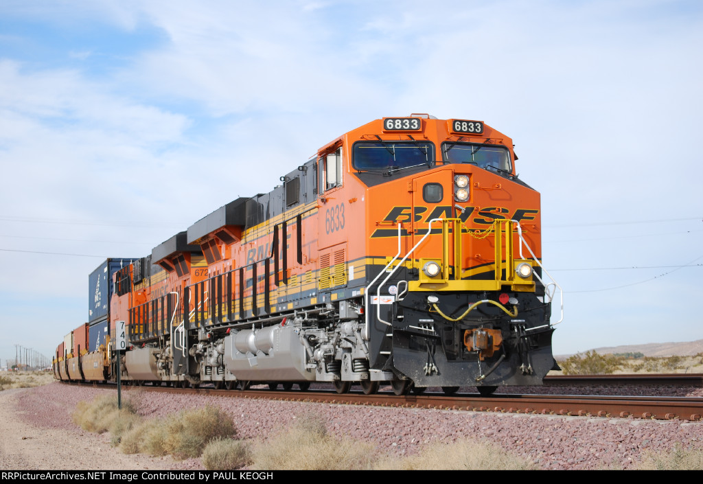 BNSF 6833 with BNSF 6723 behind Her wait to head east waiting for the Hot Z9 to pass at MP 740 ...